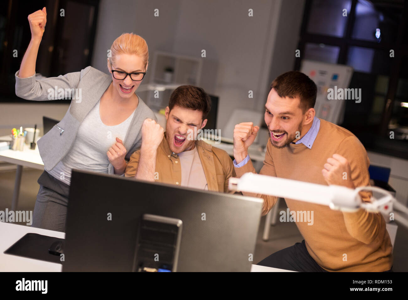 business team celebrating success at night office Stock Photo - Alamy