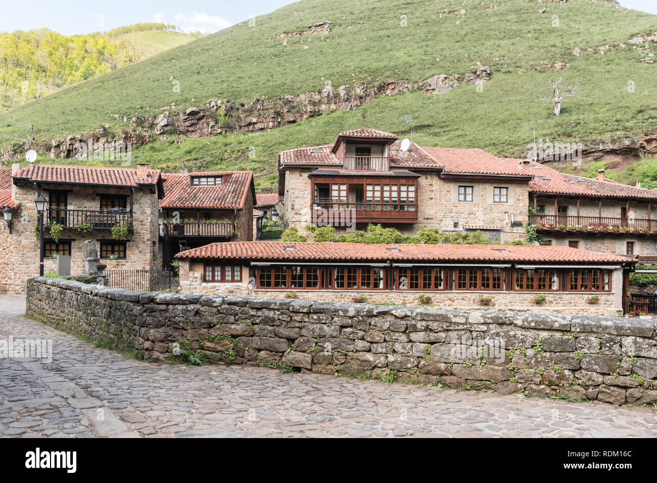 Barcena Mayor, Cabuerniga valley, with typical stone houses is one of ...