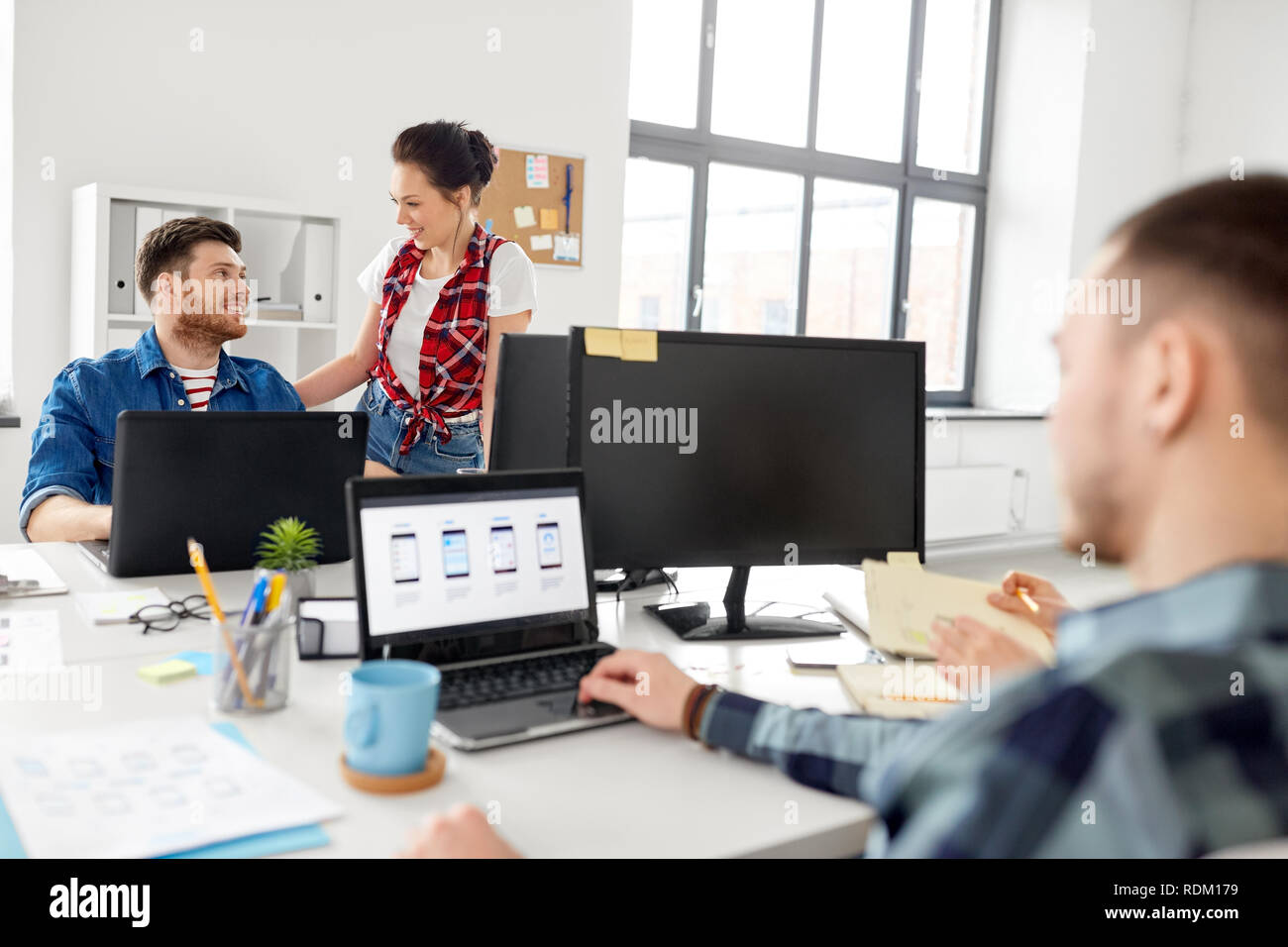 creative team working on user interface at office Stock Photo - Alamy