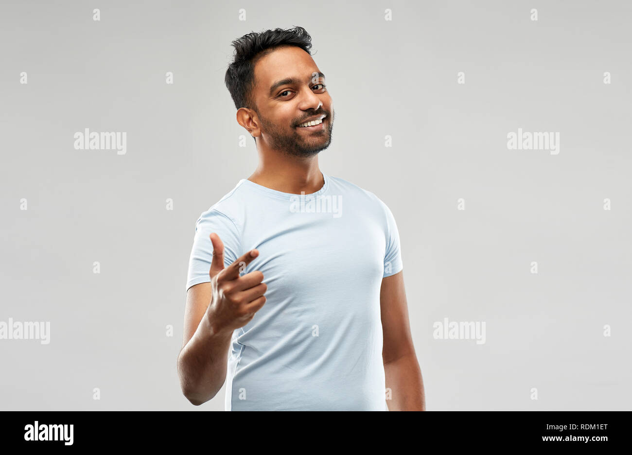 smiling indian man pointing finger at you Stock Photo - Alamy