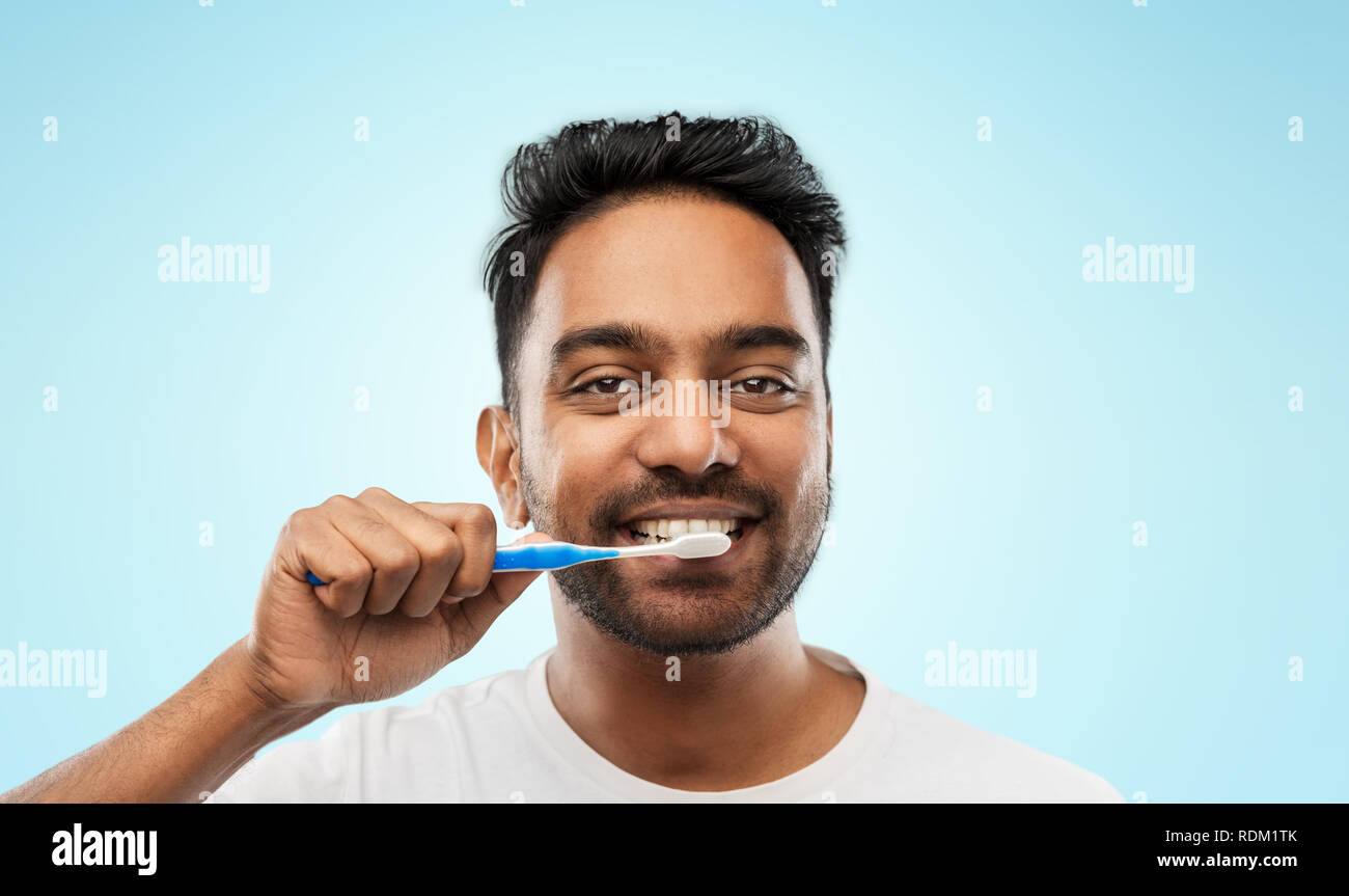 indian man with toothbrush cleaning teeth Stock Photo - Alamy