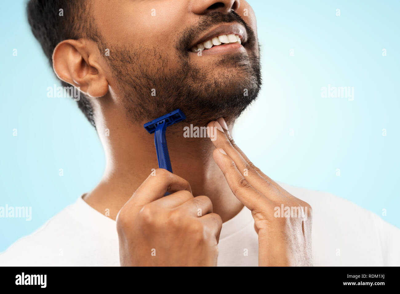close up of man shaving beard with razor blade Stock Photo - Alamy