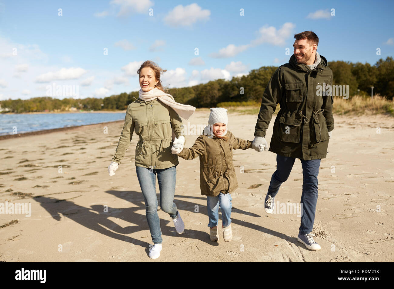 Happy family running hi-res stock photography and images - Alamy