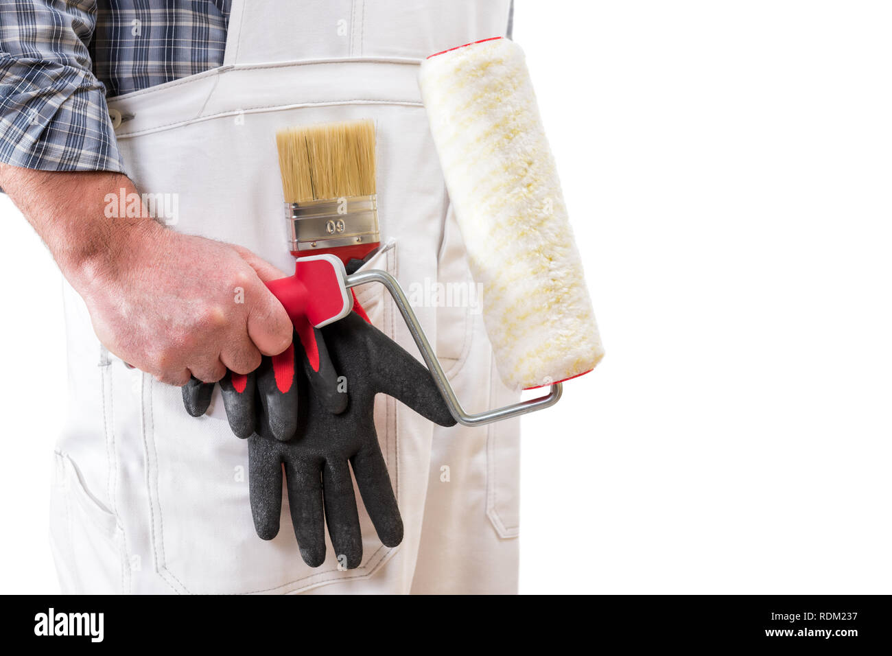 House painter worker with white work overalls, keeps the roller to ...