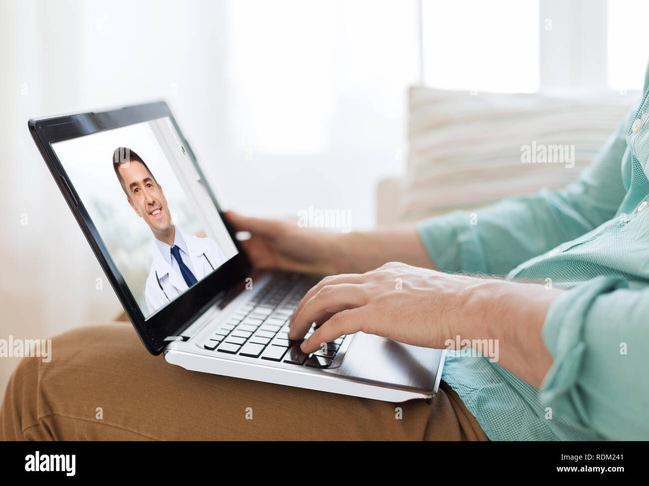 Video chat middle aged doctor hi-res stock photography and images - Alamy