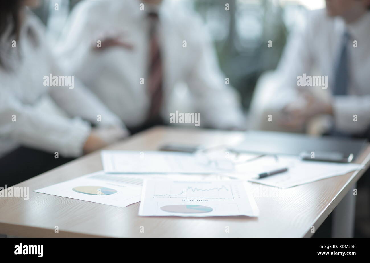 background image. closeup of a table with documents and business team ...
