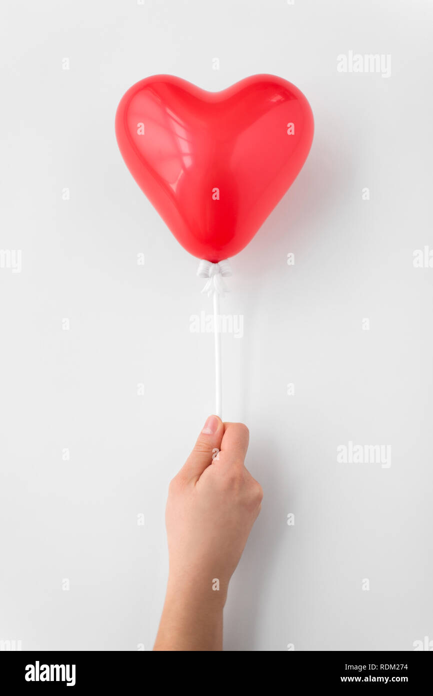 Hand holding red heart hi-res stock photography and images - Alamy