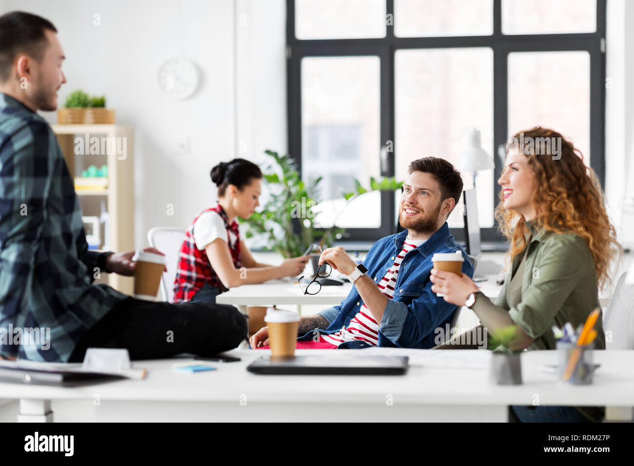 creative team drinking coffee at office Stock Photo - Alamy