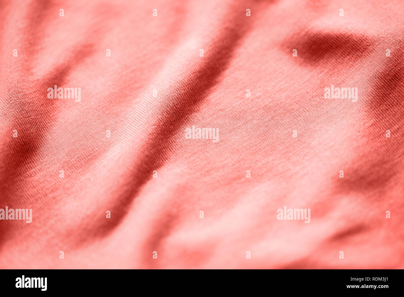 textile or fabric texture in living coral color Stock Photo - Alamy