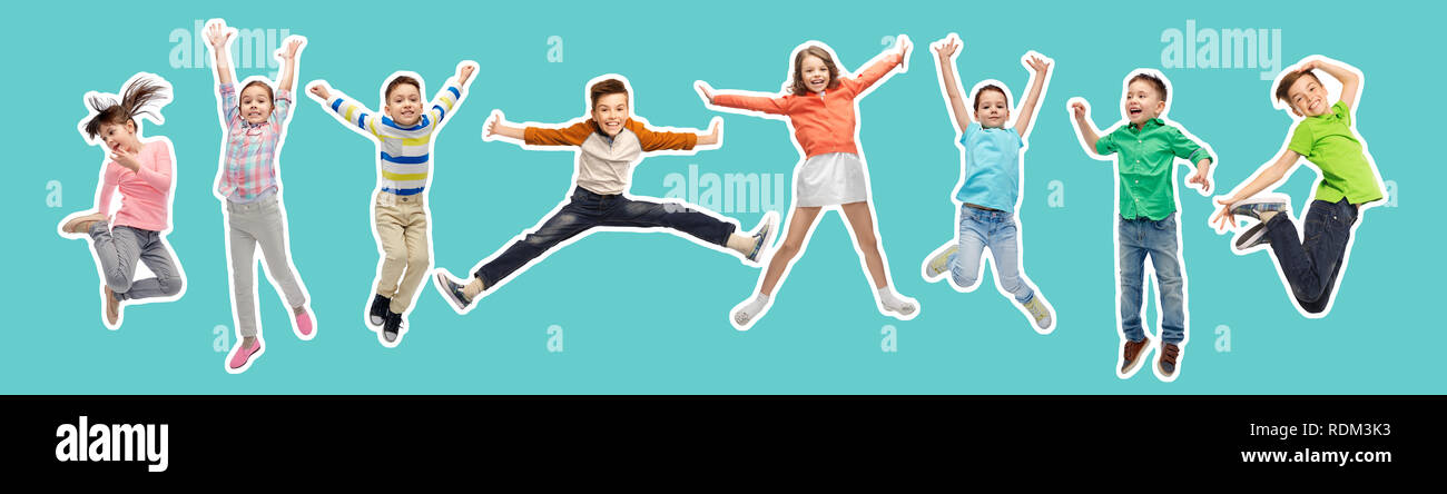 happy kids jumping in air over blue background Stock Photo - Alamy