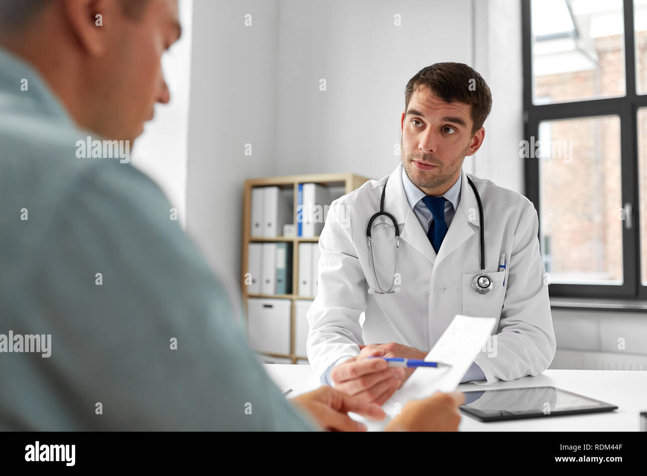 doctor giving prescription to patient at hospital Stock Photo - Alamy