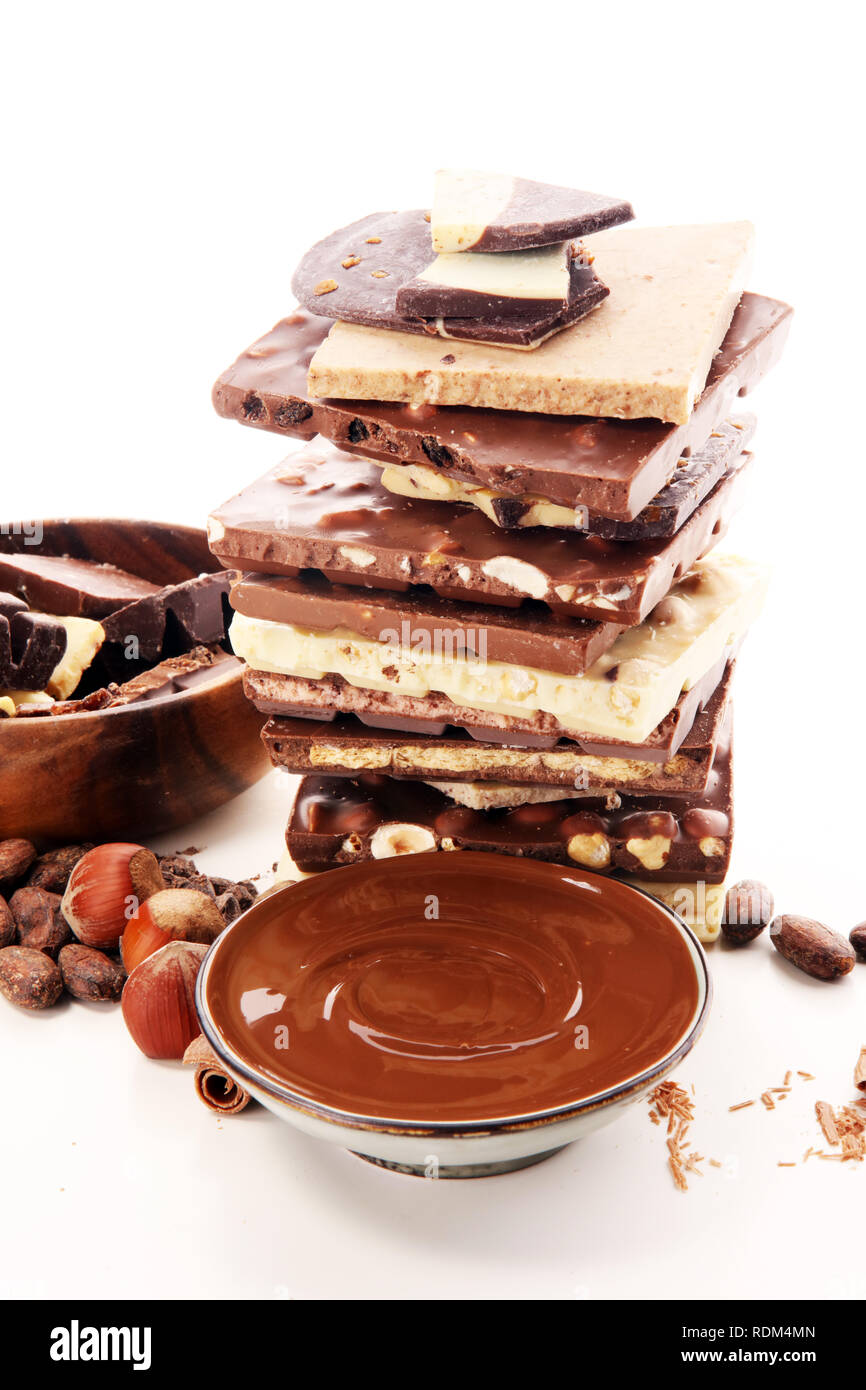 Chocolate bars on table with chocolate tower. Chocolate and nuts and ...