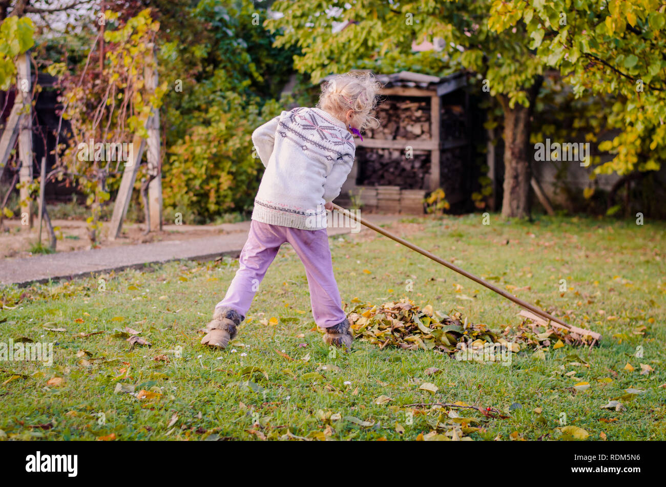 Child rake garden hi-res stock photography and images - Alamy