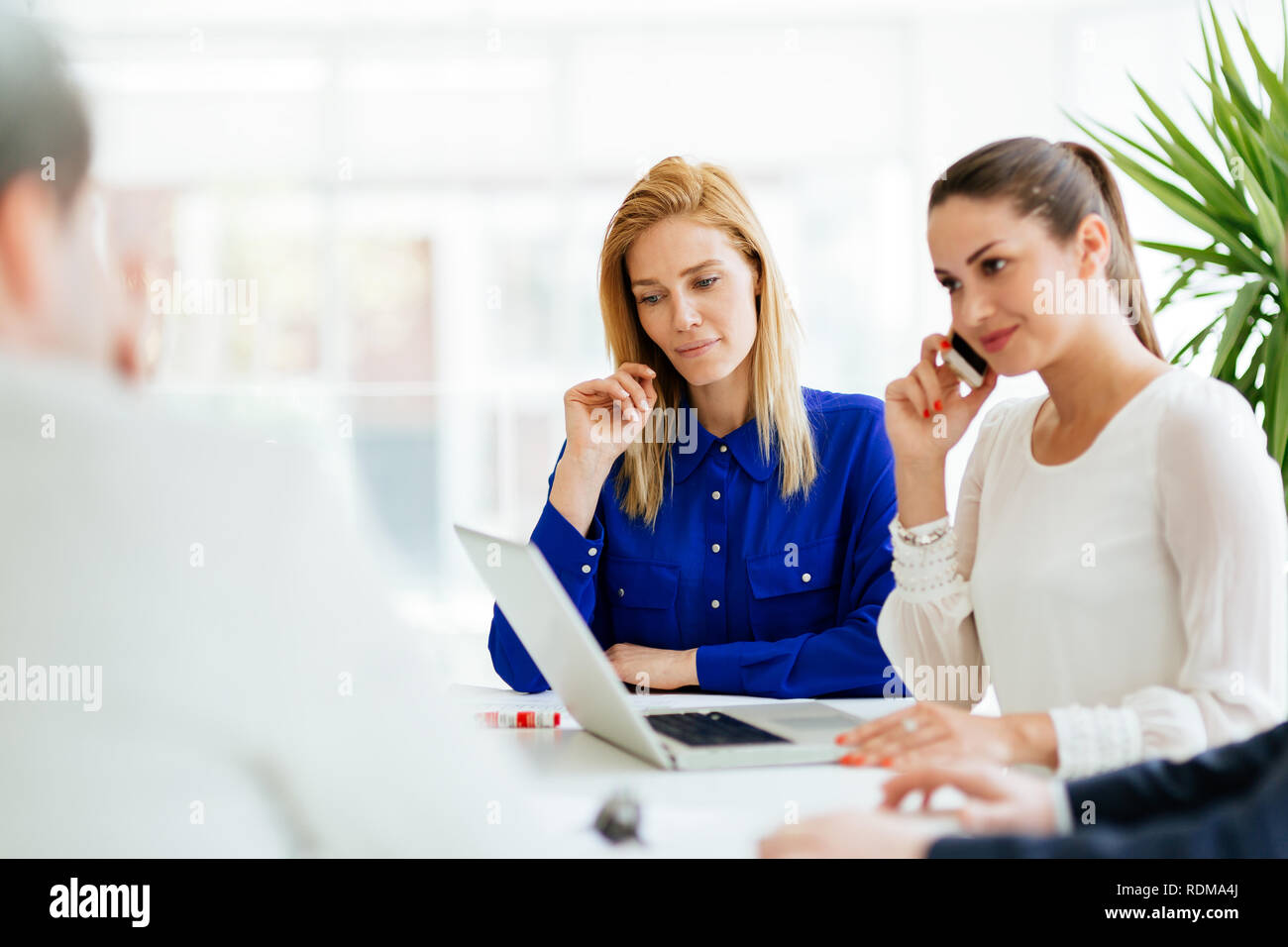 Business women working in office Stock Photo - Alamy