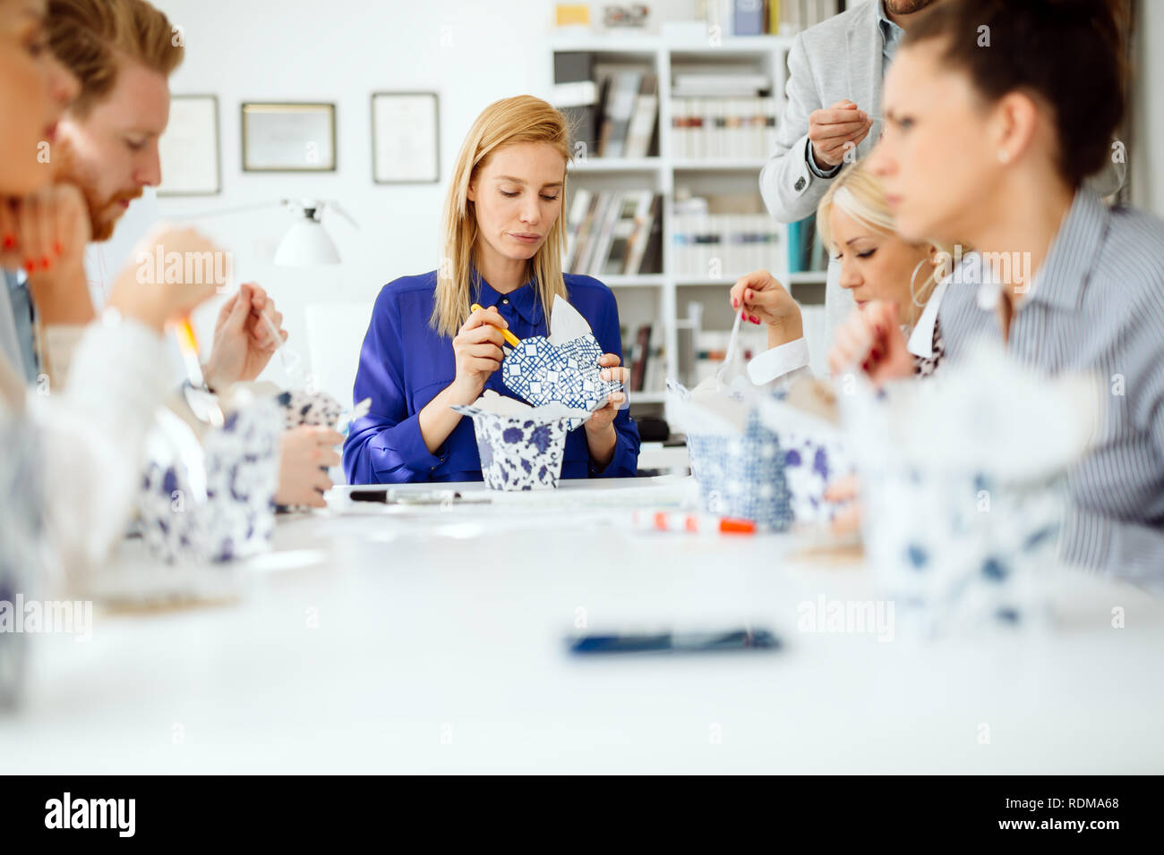 Business people eating in office Stock Photo - Alamy