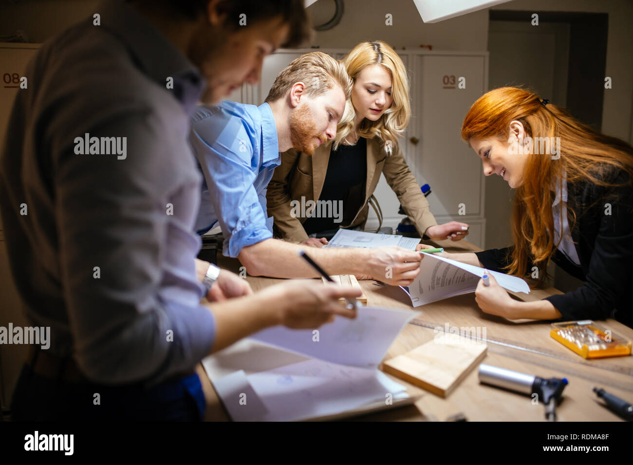 Team working on project together Stock Photo - Alamy