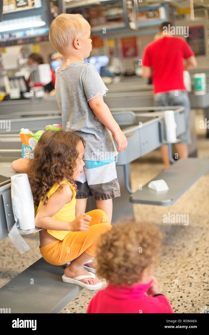 Children in shop Stock Photo - Alamy