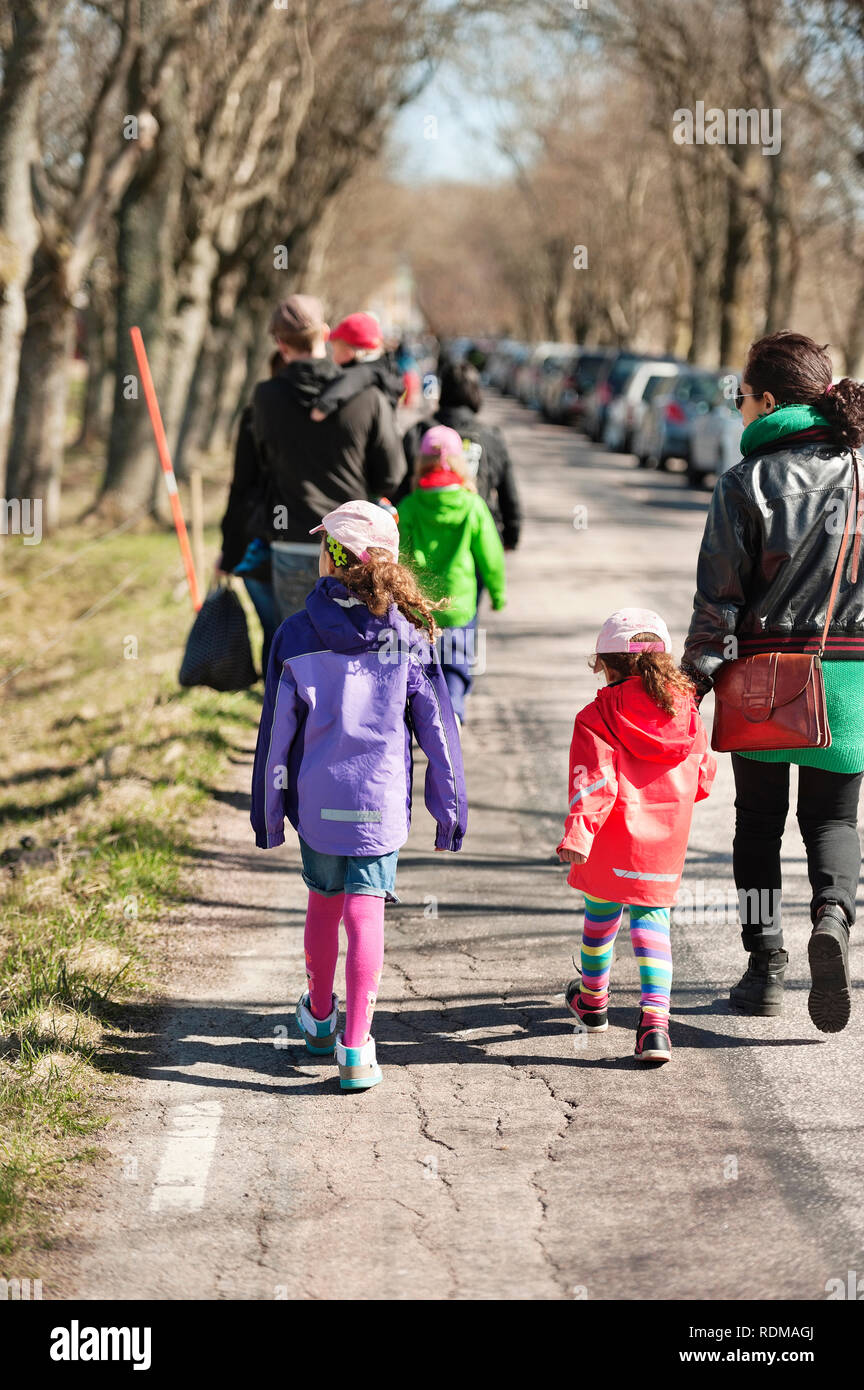 Mother walking with children Stock Photo - Alamy
