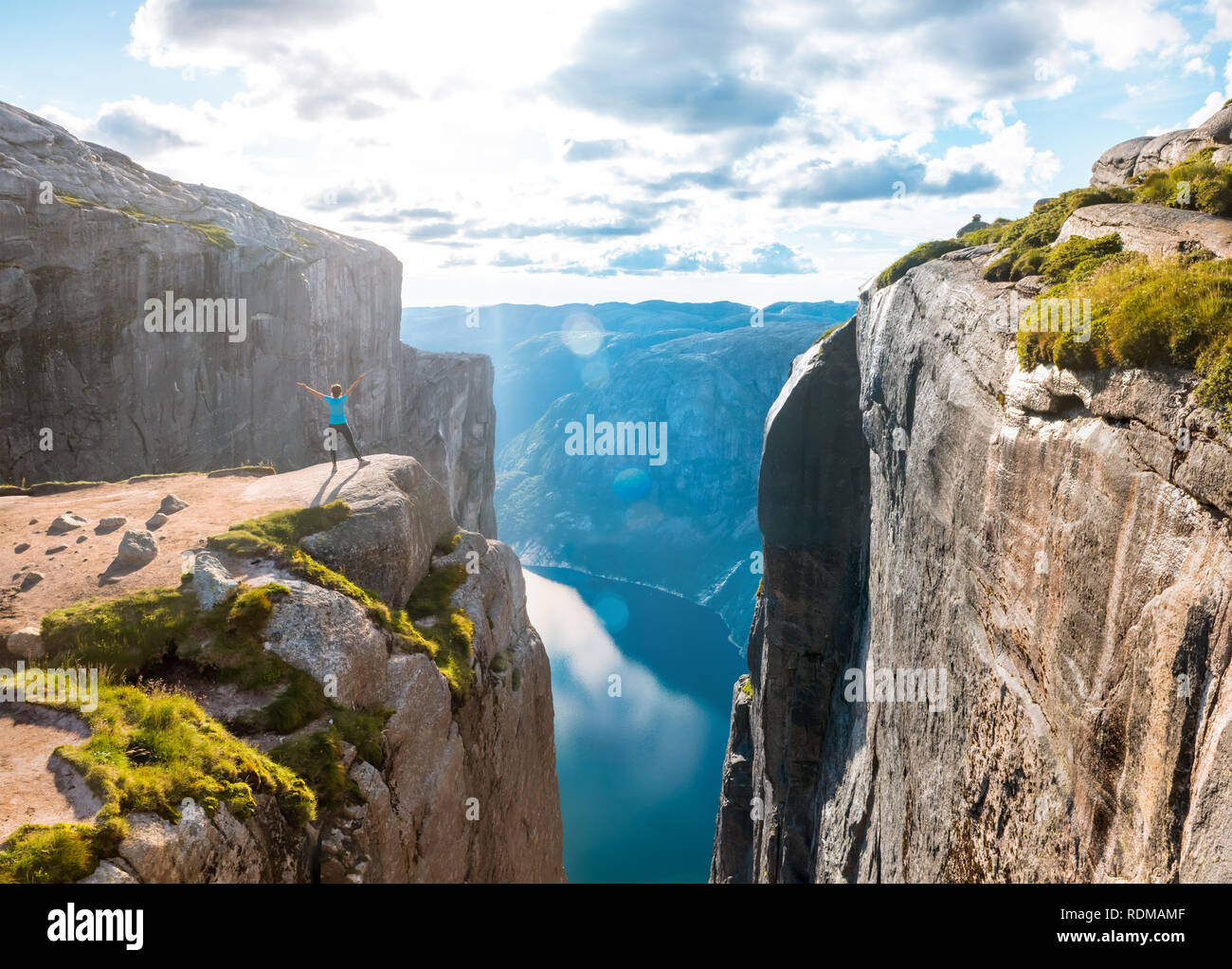 Woman on Kjeragbolten Travel in Norway Kjerag mountains, extreme ...