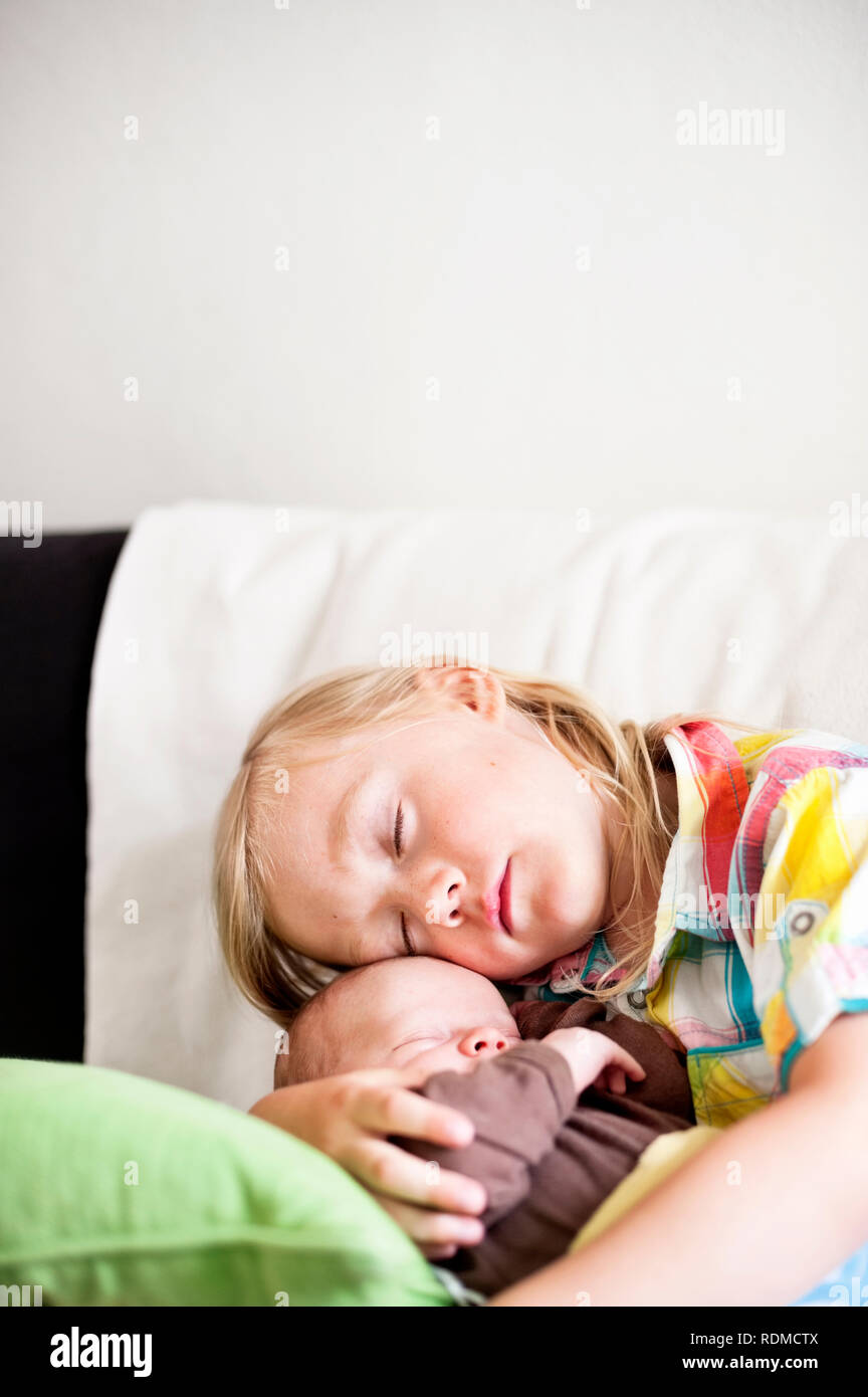 Sister taking care of little brother Stock Photo - Alamy