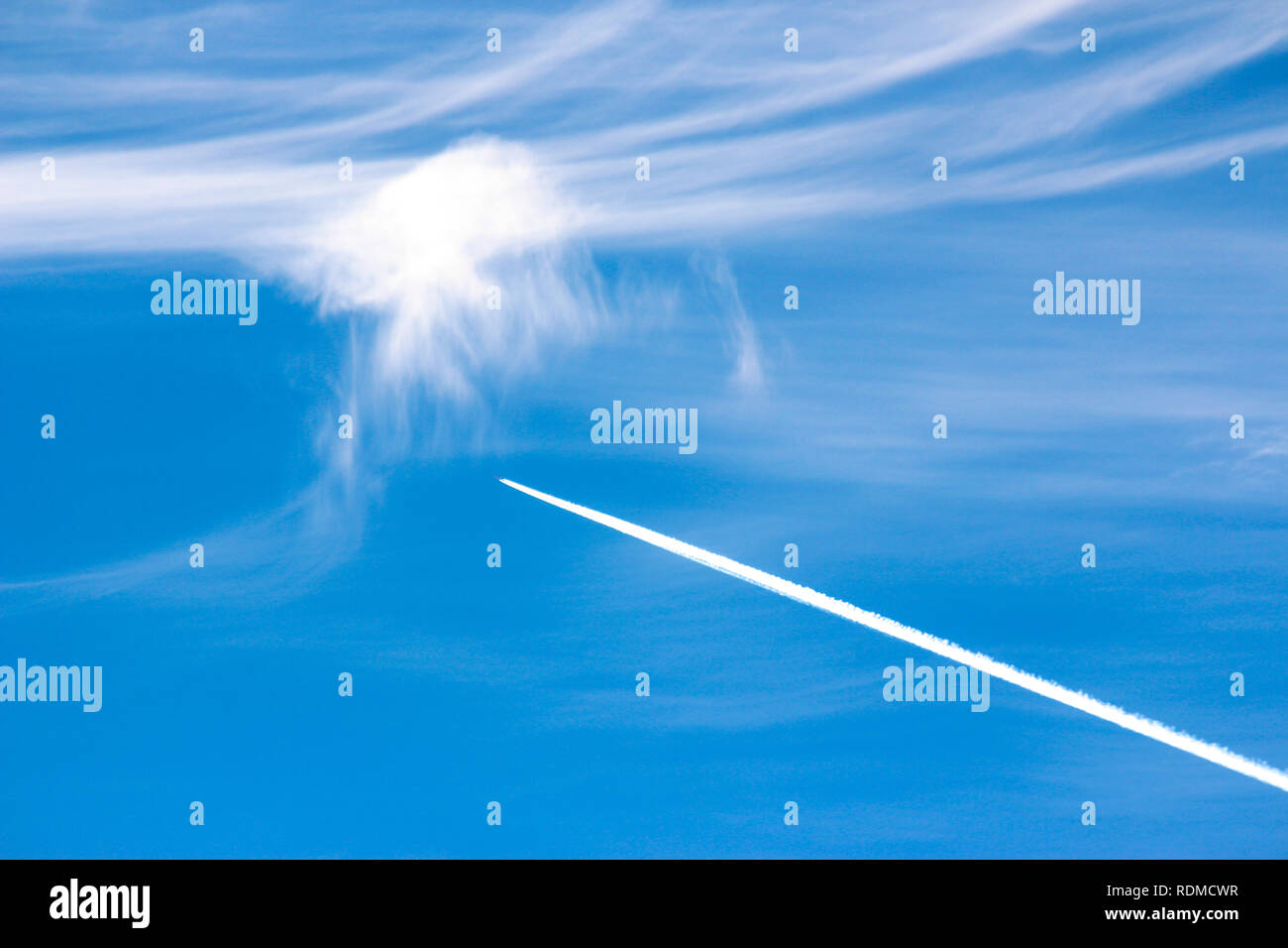 blue sky background with contrails and clouds Stock Photo - Alamy