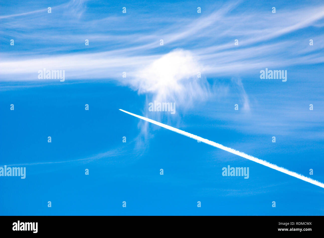 blue sky background with contrails and clouds Stock Photo - Alamy