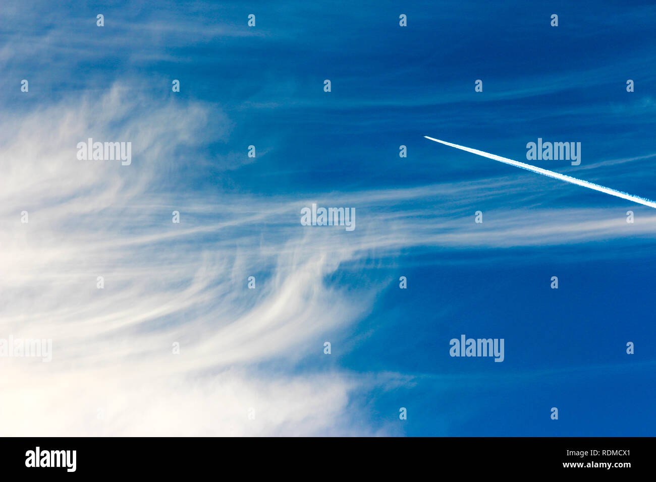 blue sky background with contrails and clouds Stock Photo - Alamy