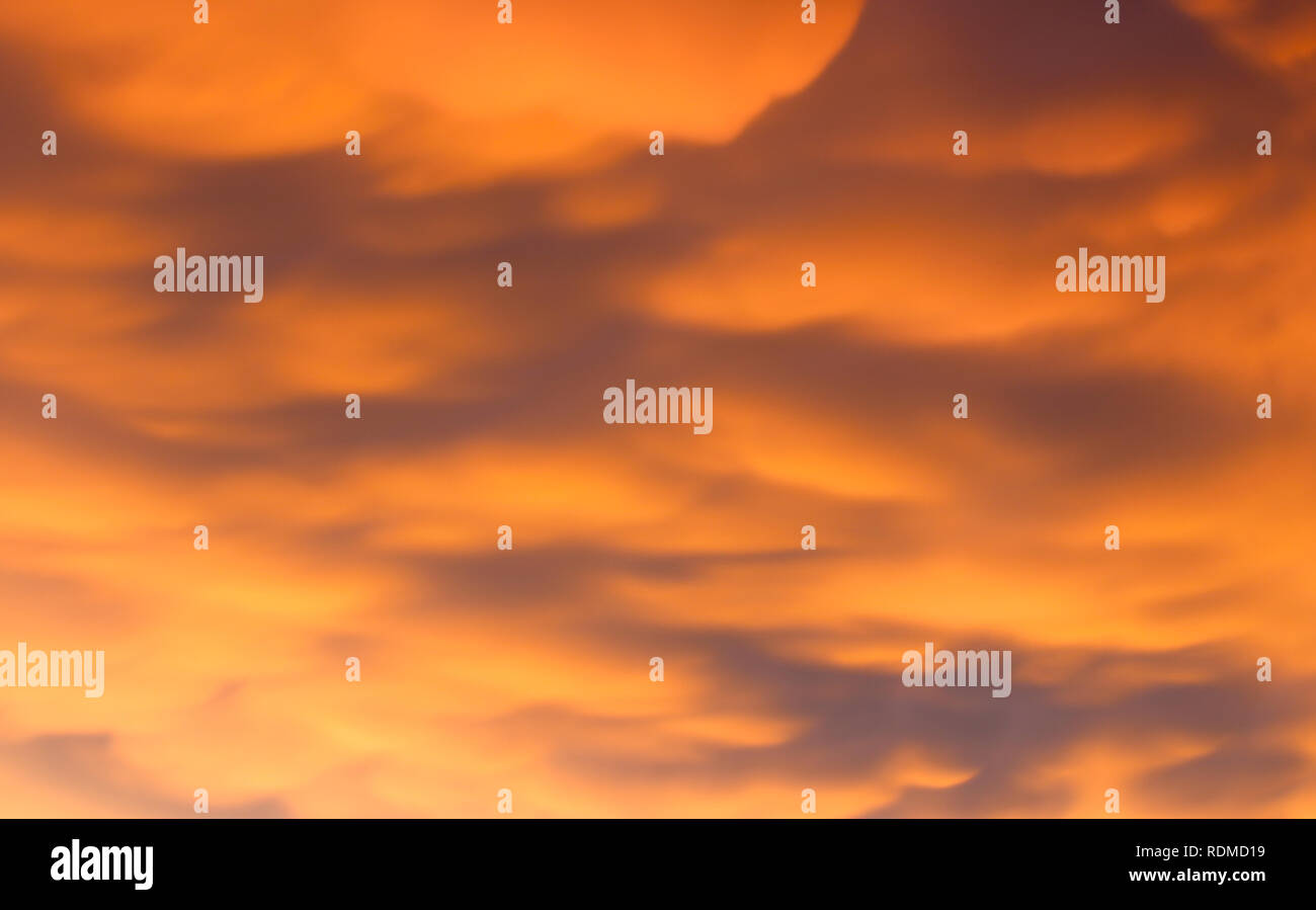 Orange sky with clouds, beautiful background Stock Photo - Alamy