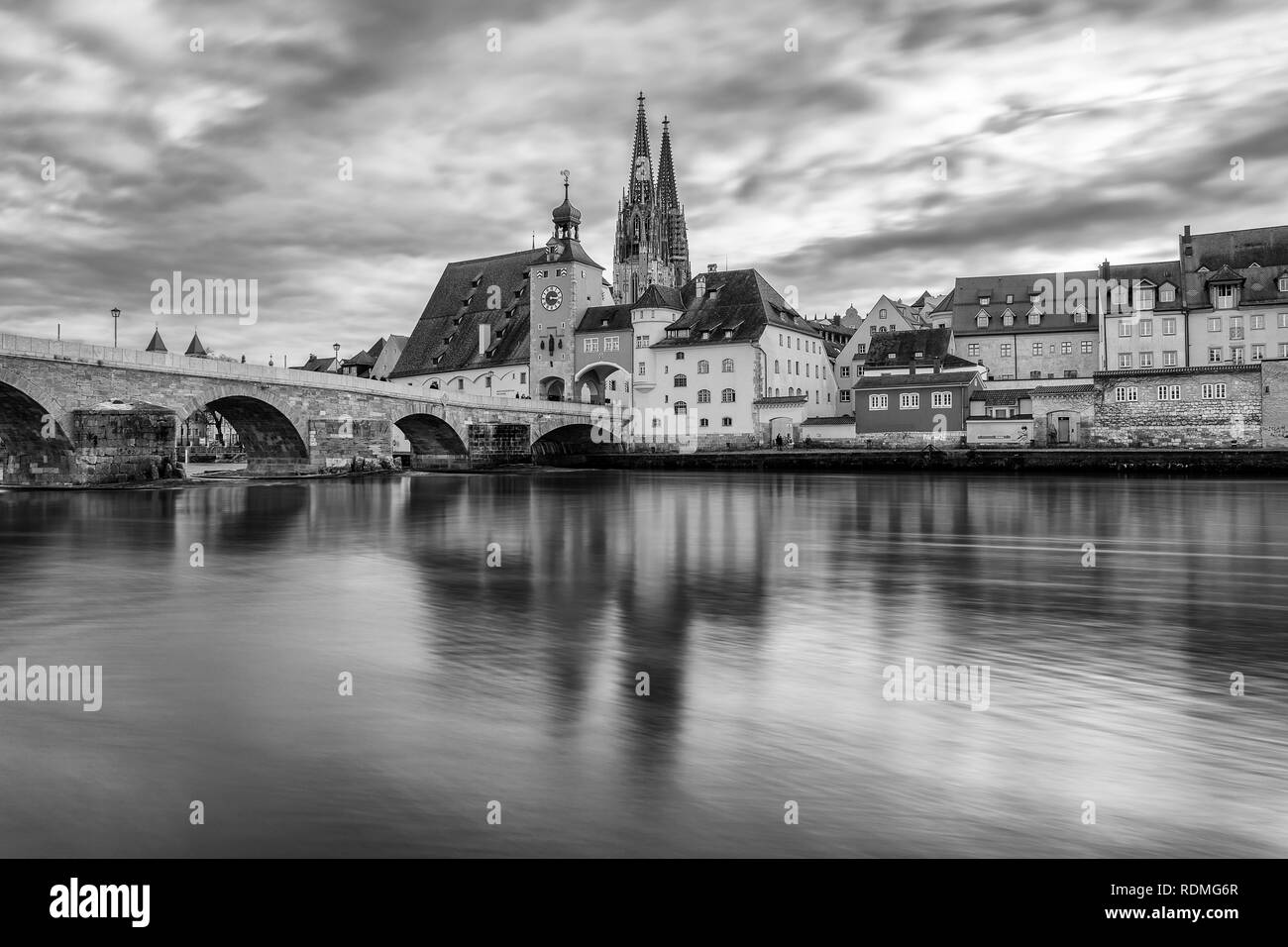 Medieval stone arch bridge over the Danube river with historic ...