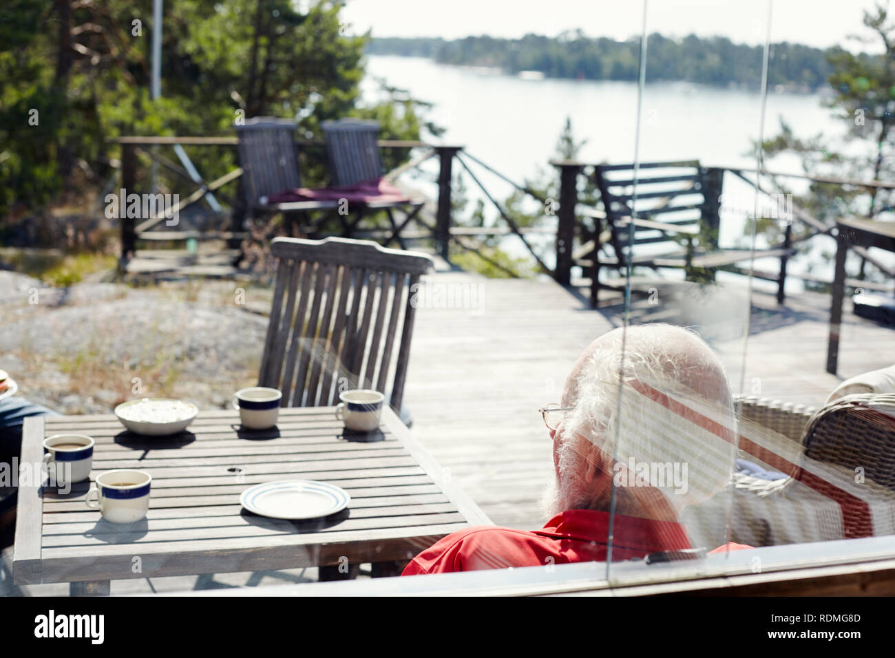 Old man deck chair hi-res stock photography and images - Alamy