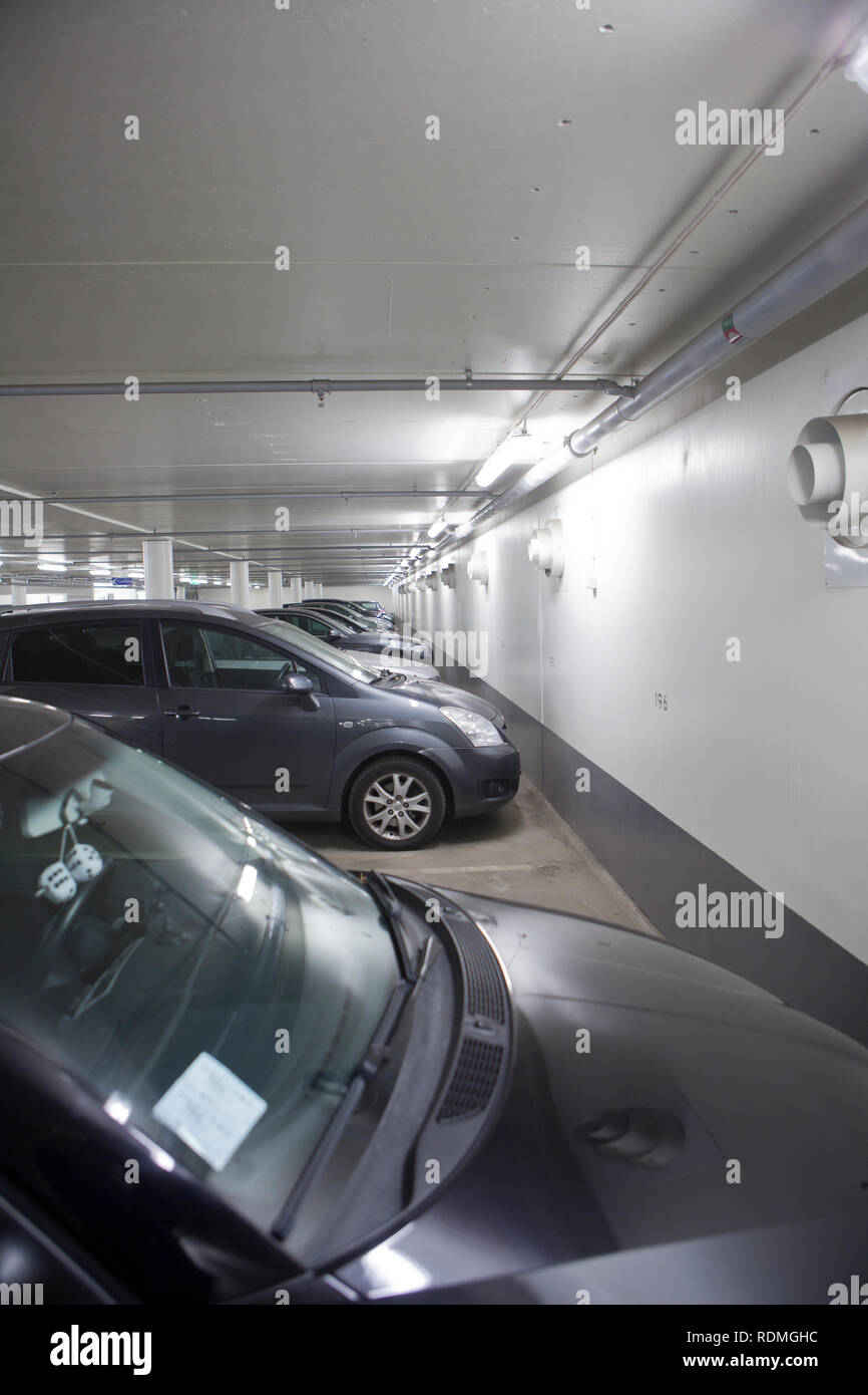 Cars in underground parking lot Stock Photo - Alamy