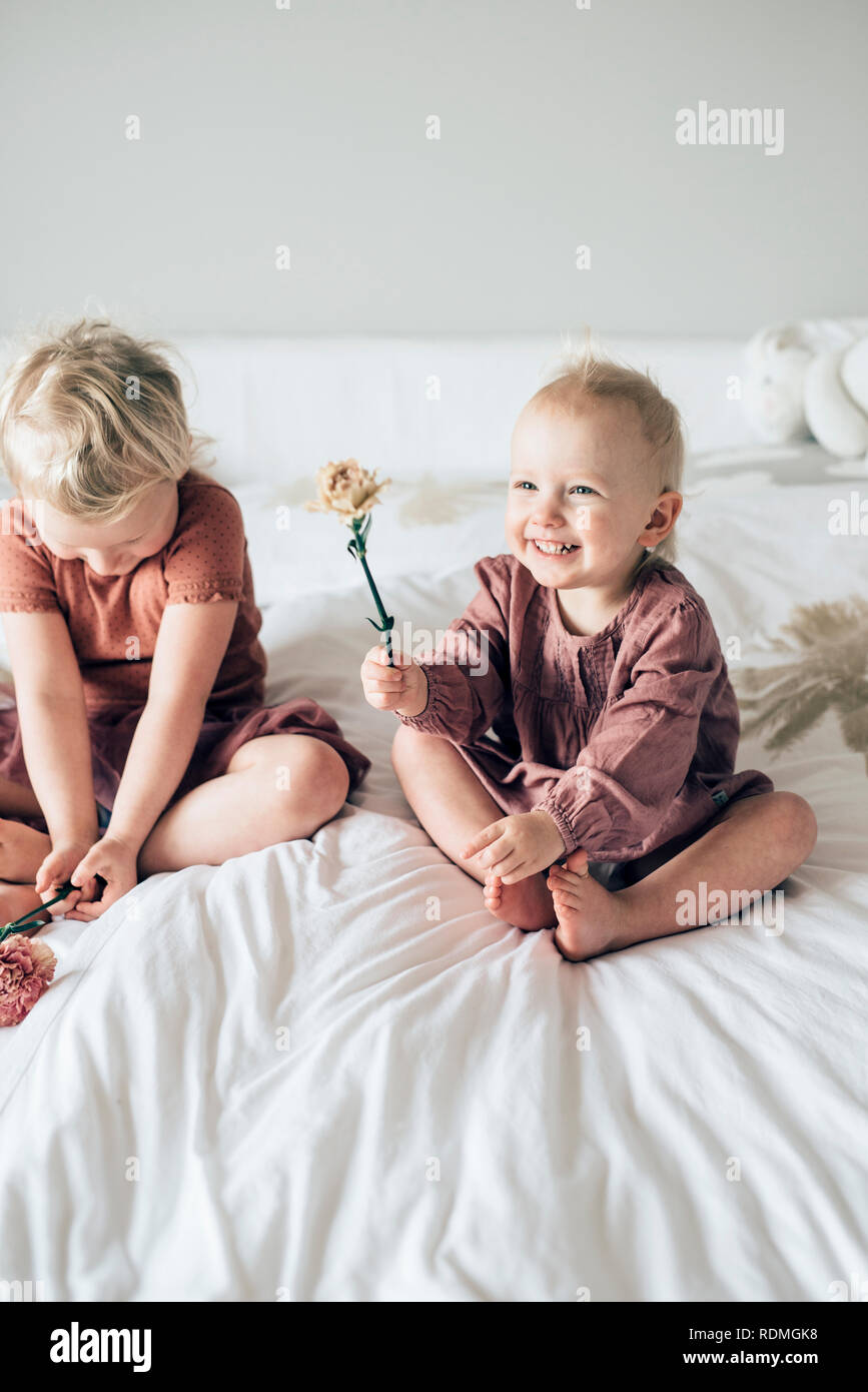 Brother and sister on bed Stock Photo - Alamy