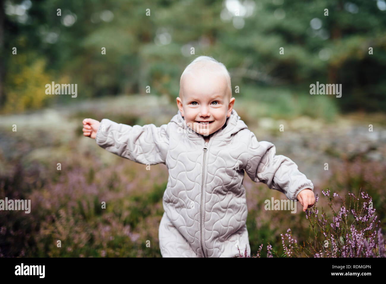 Happy baby boy walking hi-res stock photography and images - Alamy