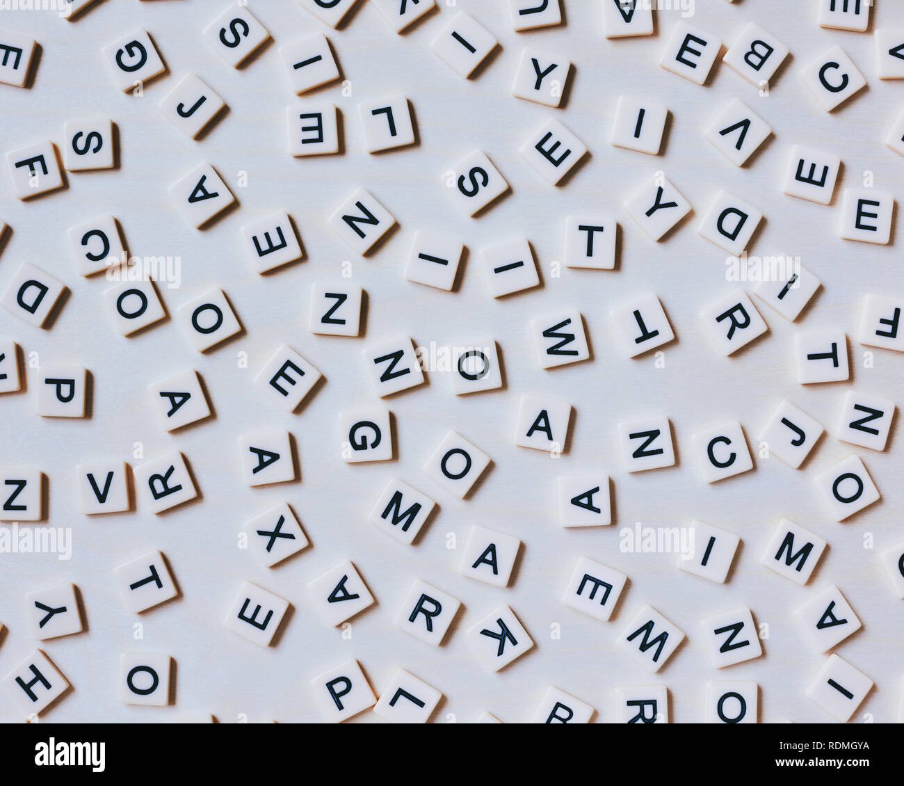 Arrangement of small blocks of scattered letters Stock Photo - Alamy