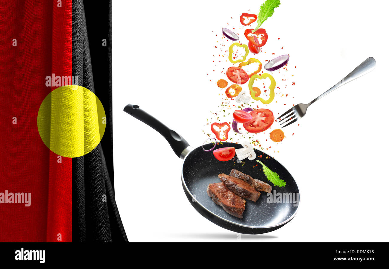Frying pan with falling vegetables and meat, isolated objects. On the ...