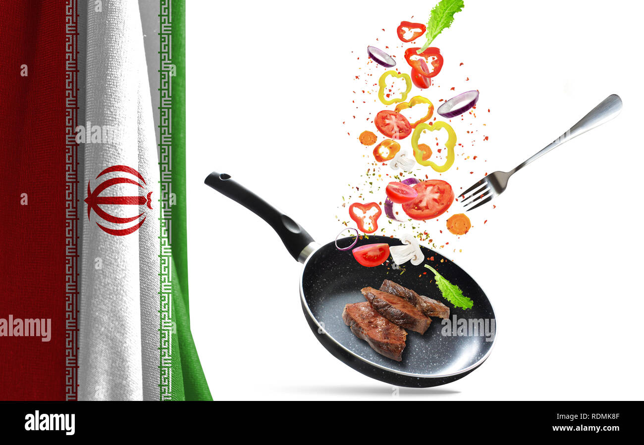 Frying pan with falling vegetables and meat, isolated objects. On the ...