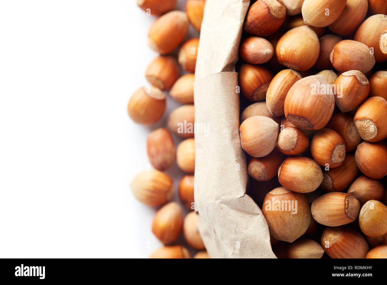 Fresh ripe organic hazelnuts (filbert) in brown grocery paper bag ...