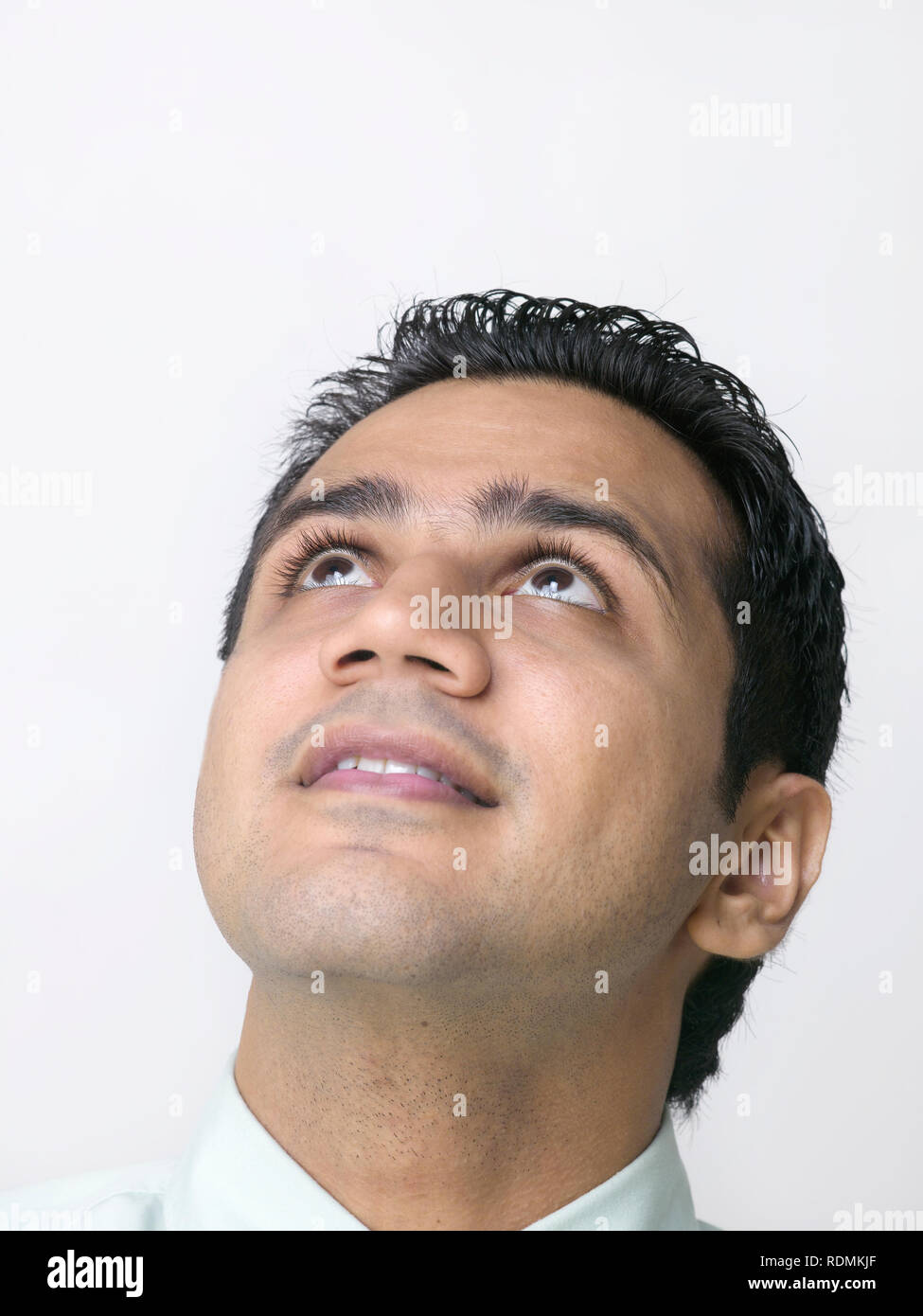 PORTRAIT OF A CORPORATE EXECUTIVE LOOKING UPWARDS Stock Photo - Alamy