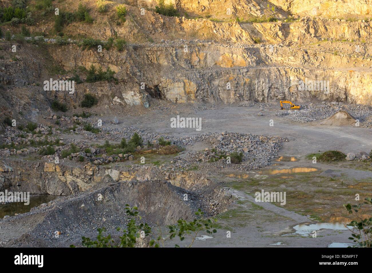 granite walls of stone quarry at the sunset time Stock Photo - Alamy