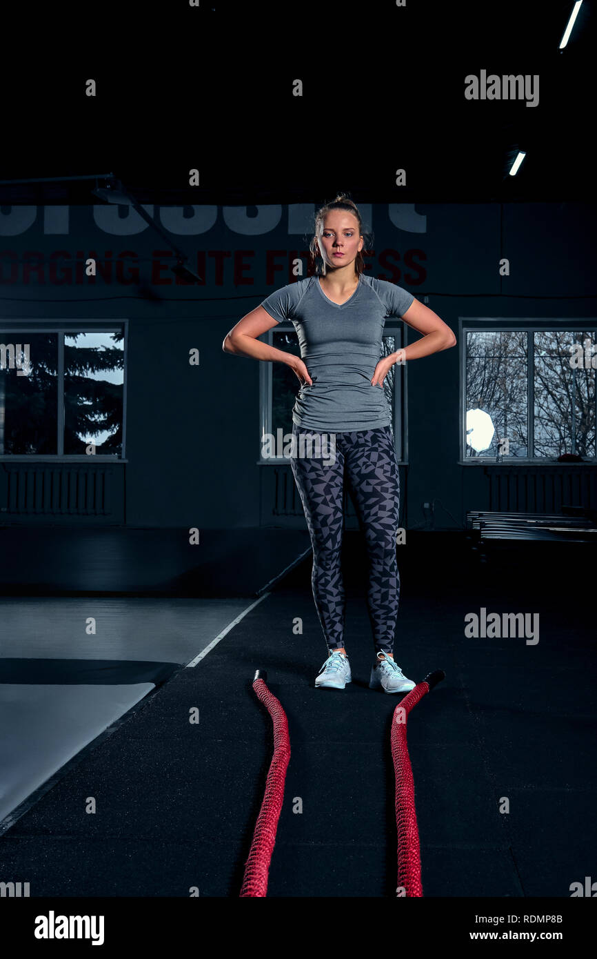 Crossfit workout. Vertical full length shot of an athletic fitness ...