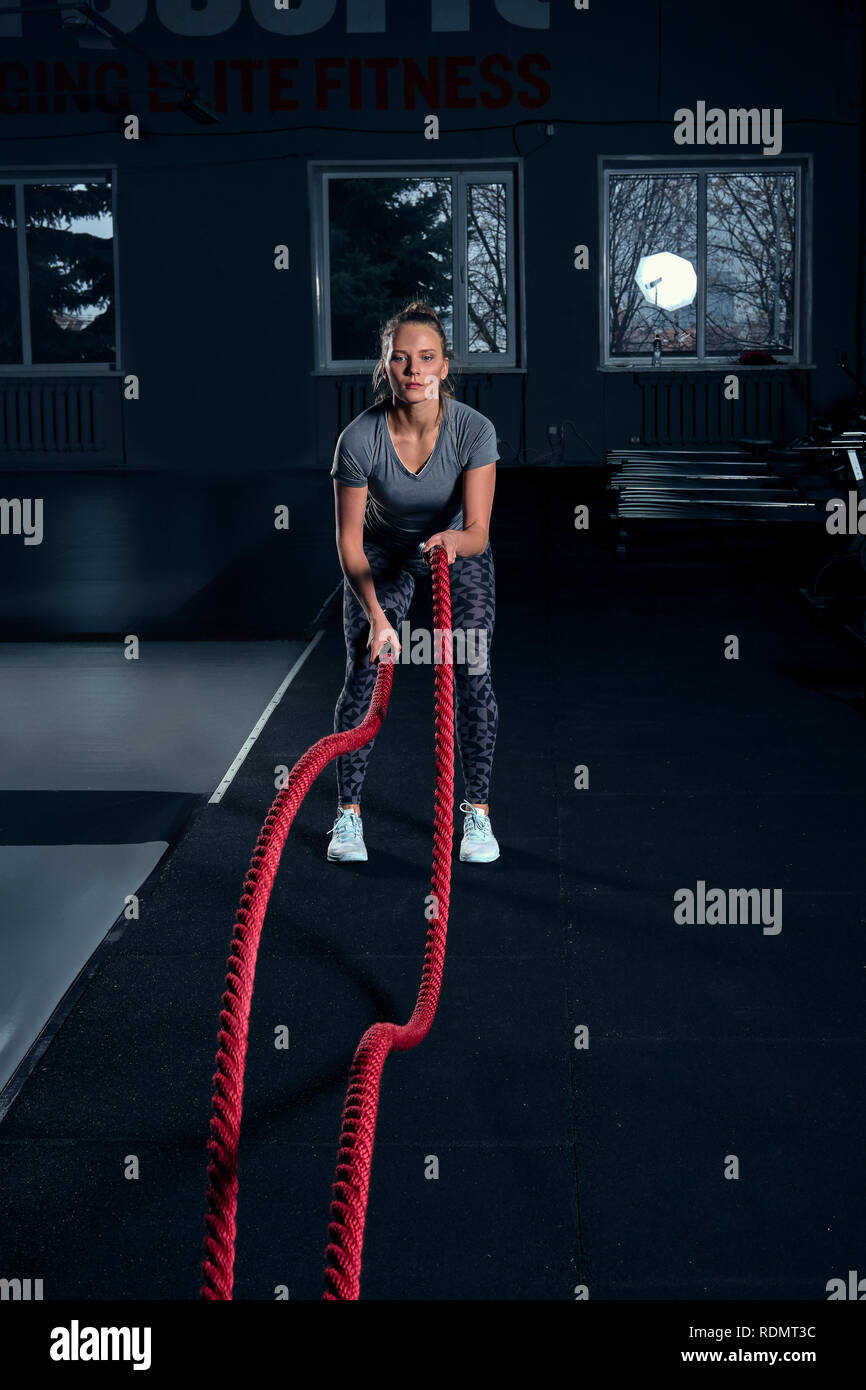 Crossfit workout. Vertical full length shot of an athletic fitness ...