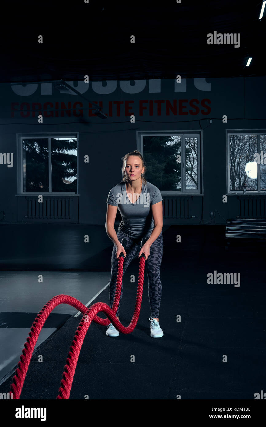 Crossfit workout. Vertical full length shot of an athletic fitness ...