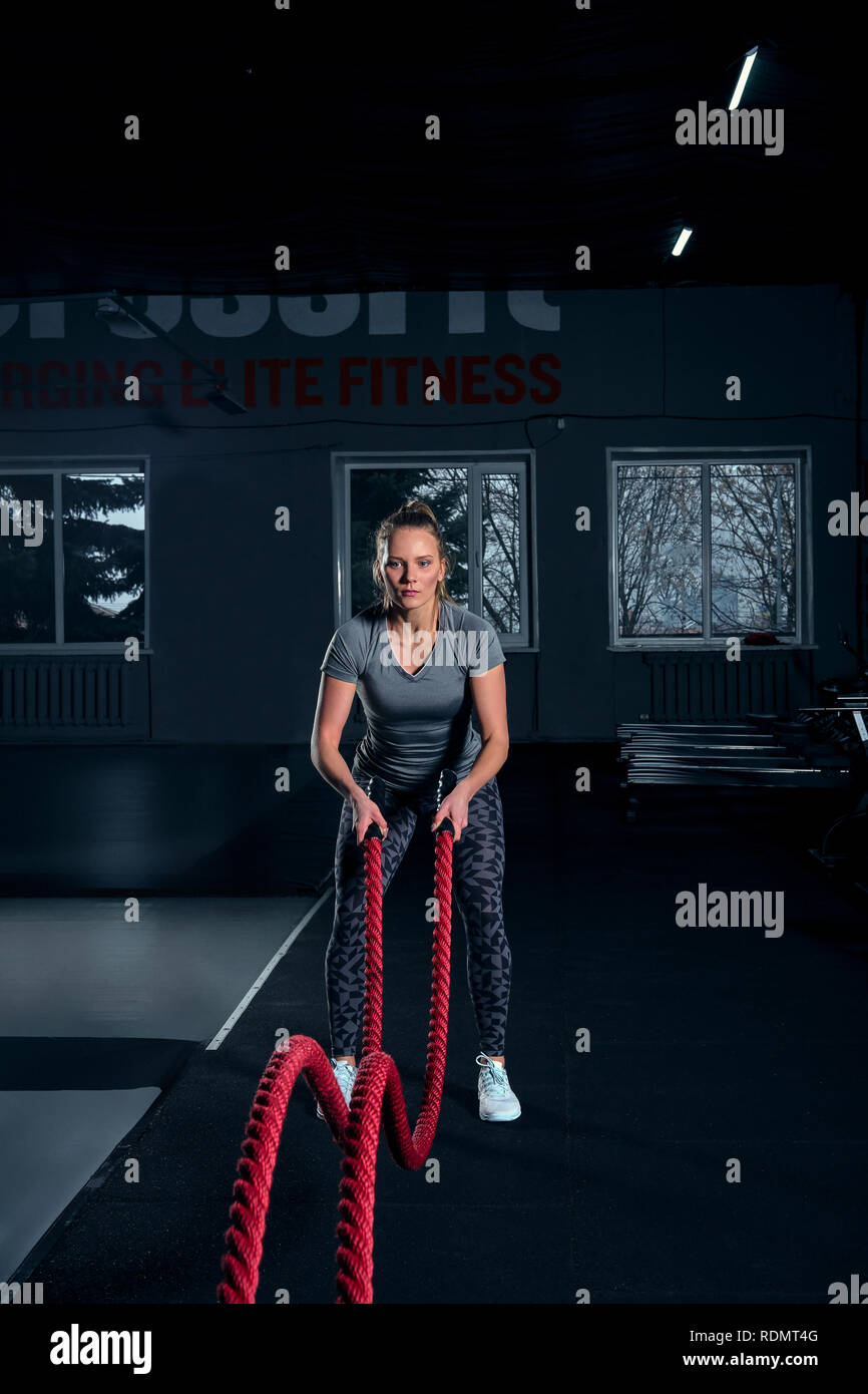Crossfit workout. Vertical full length shot of an athletic fitness ...