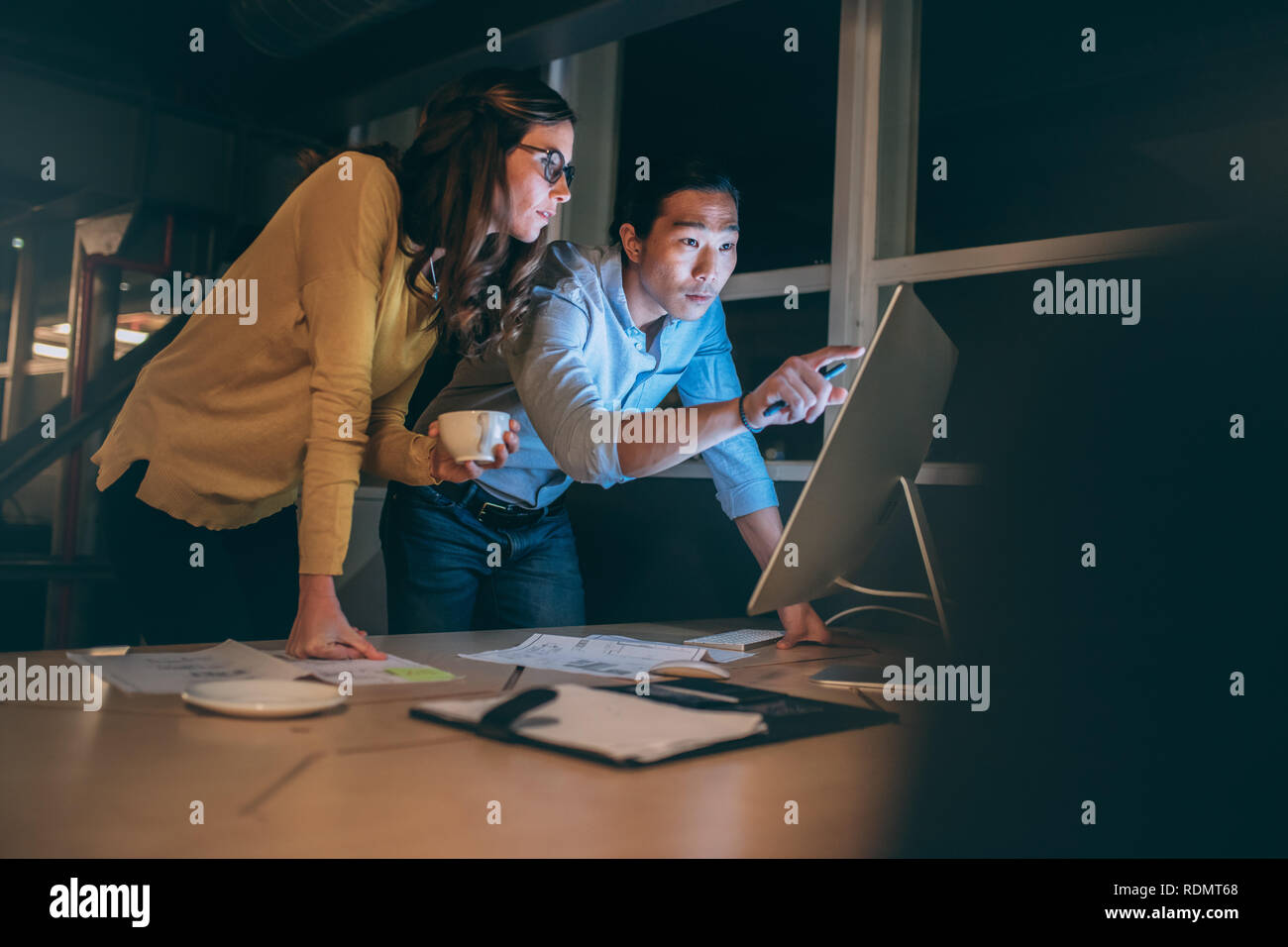 Two businesspeople working seriously computer hi-res stock photography ...