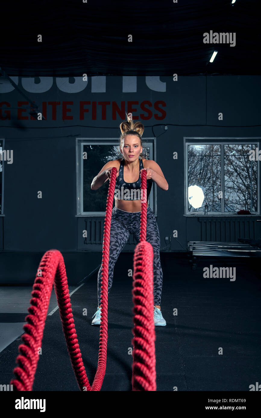 Crossfit workout. Vertical full length shot of an athletic fitness ...