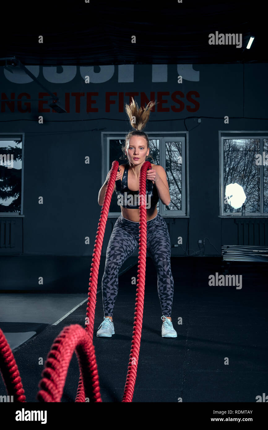 Crossfit workout. Vertical full length shot of an athletic fitness ...