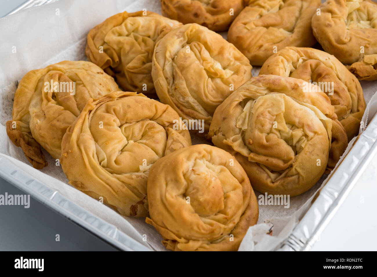 Baked homemade traditional Greek cheese pies Stock Photo - Alamy