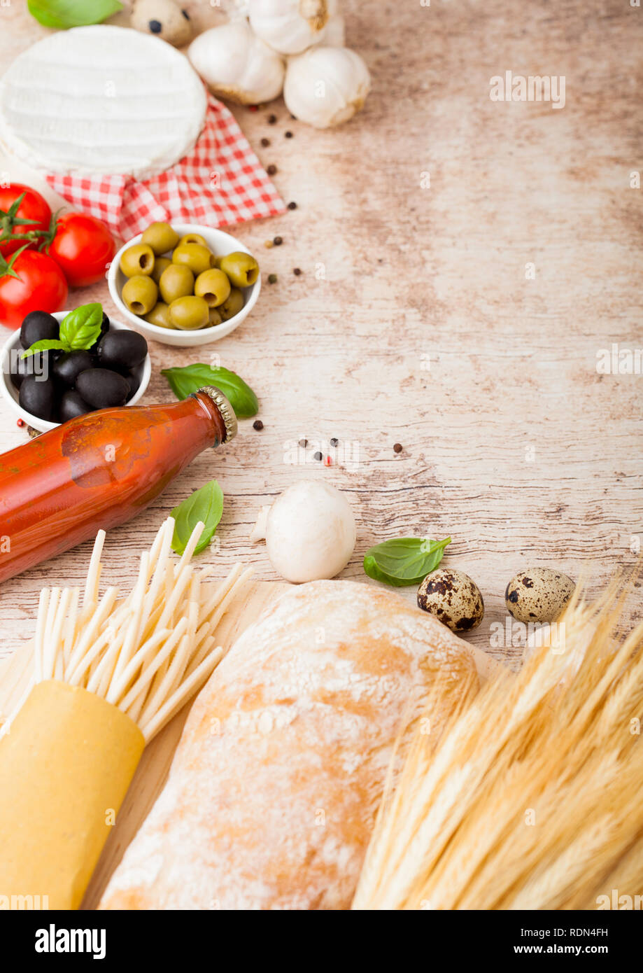 Homemade spaghetti pasta with quail eggs with bottle of tomato sauce ...