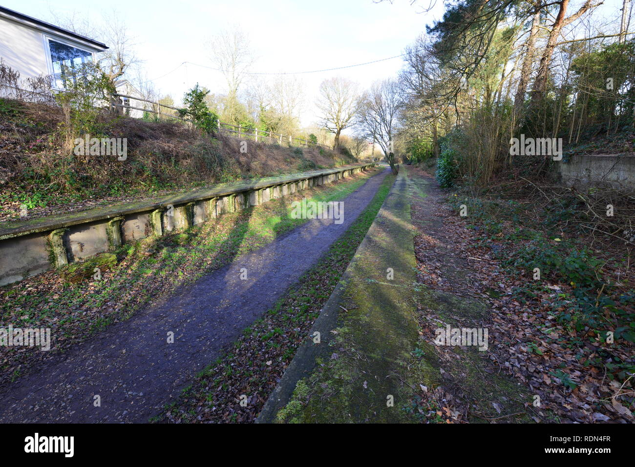 Closed and abandoned railway station at West Grinstead in West Sussex ...