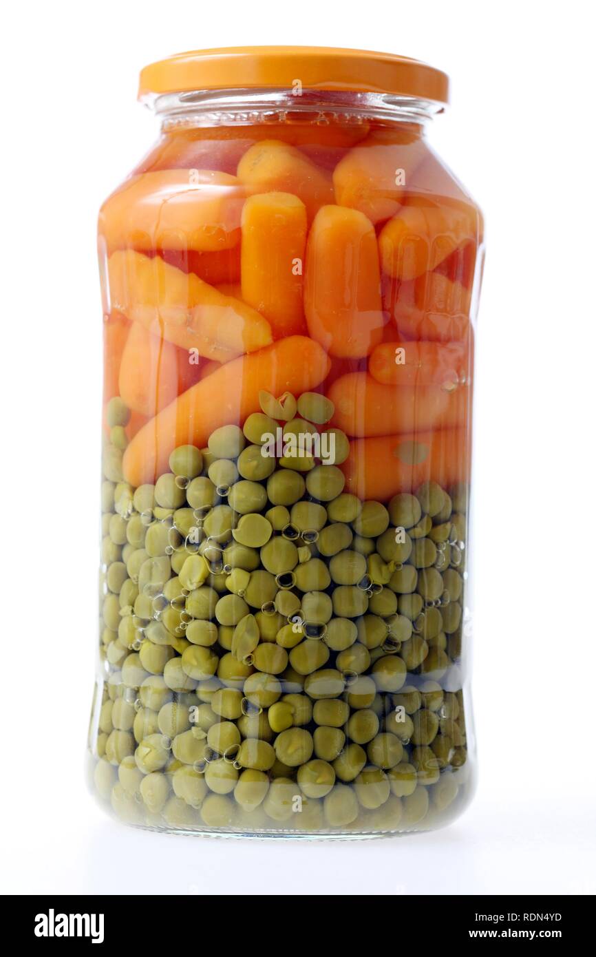 Peas and carrots conserved in glass packaging Stock Photo - Alamy
